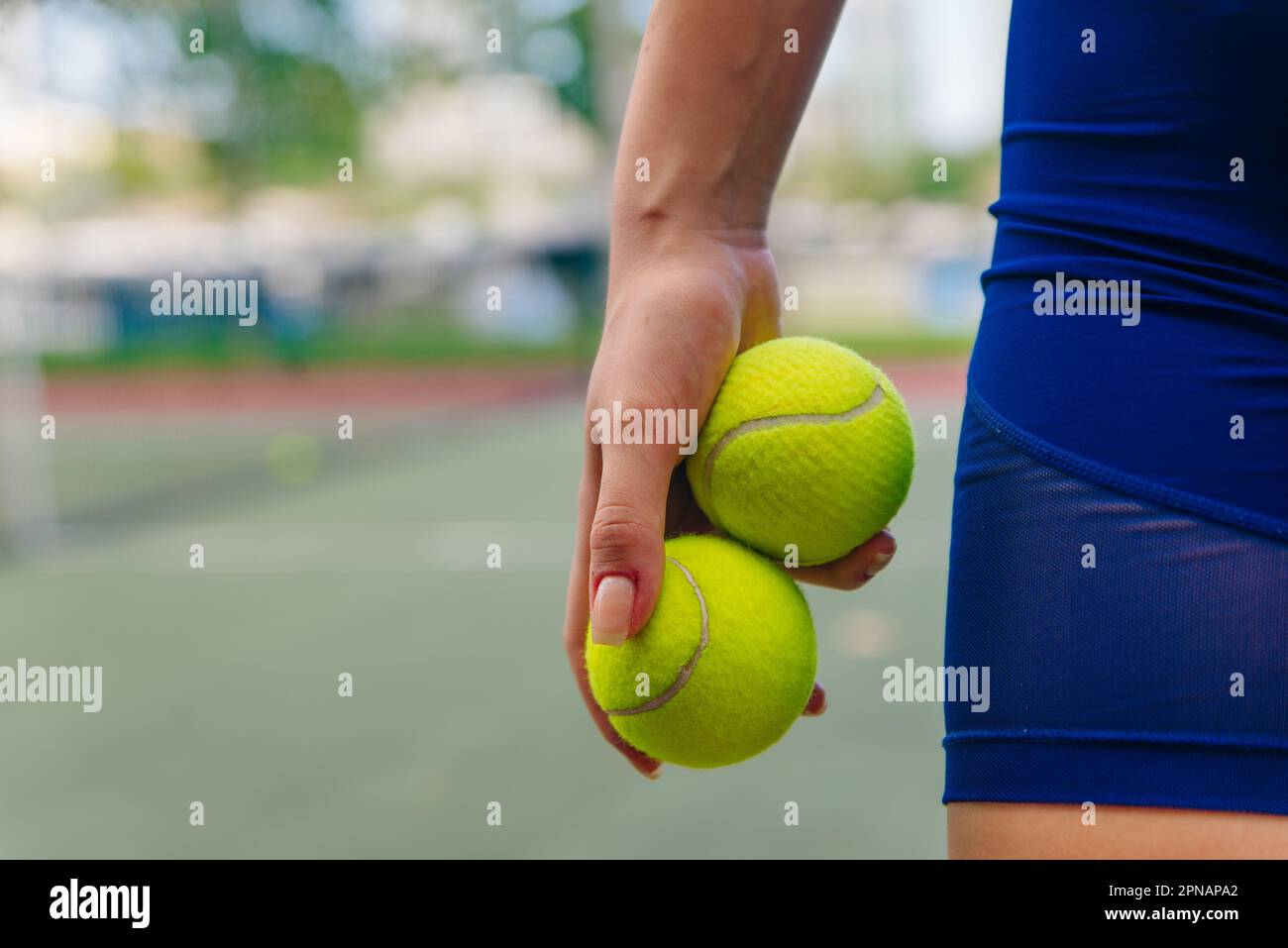 Ball girl holding tennis balls hi-res stock photography and images - Alamy