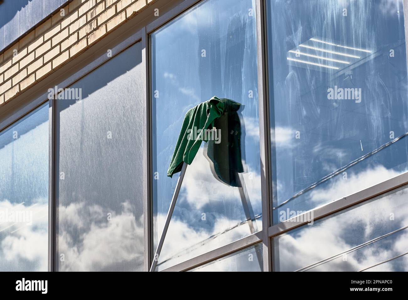 window washing, washing a street shop window Stock Photo - Alamy