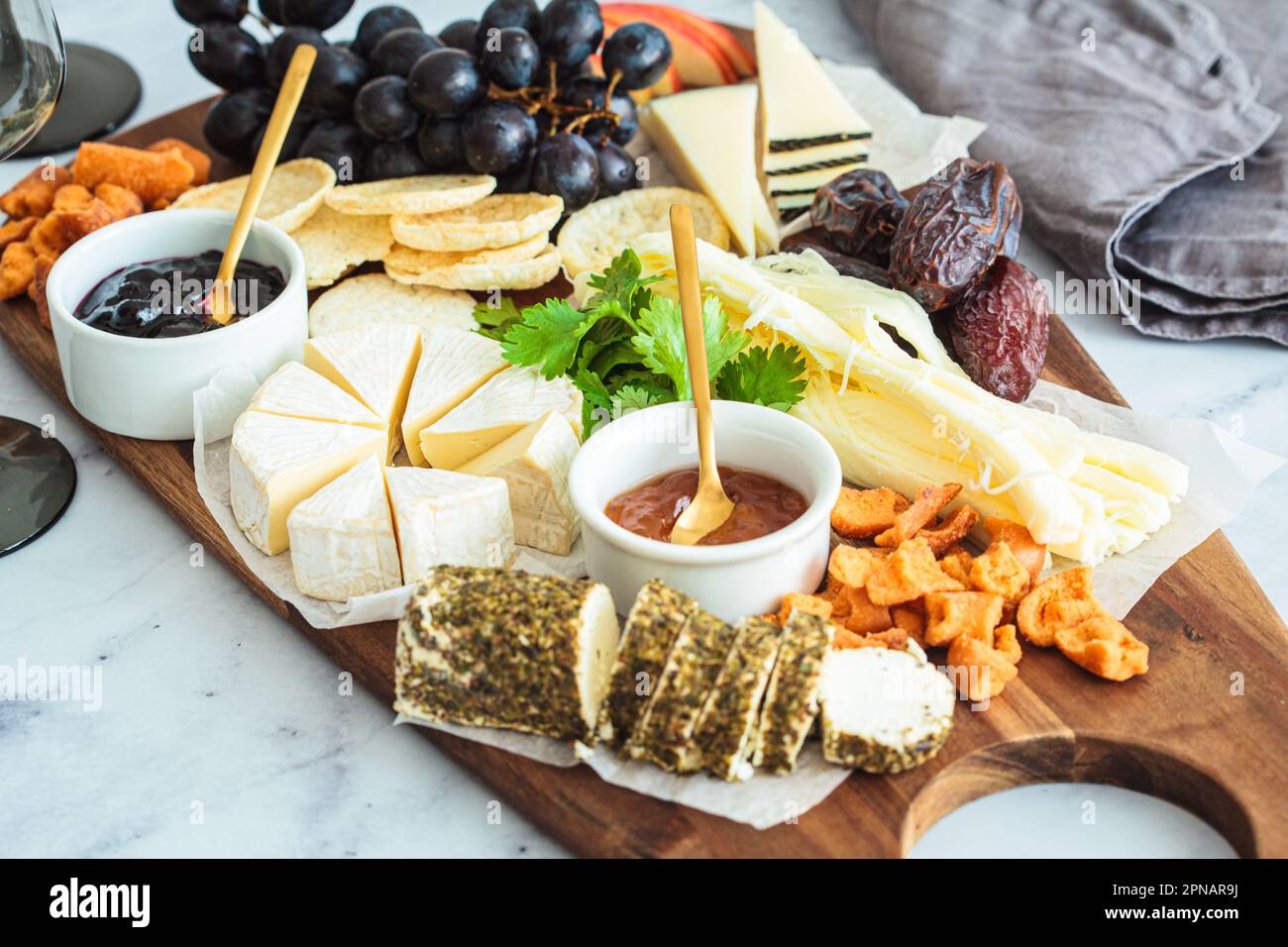 Cheese board with fruits and crackers, close-up. Party food, food ...