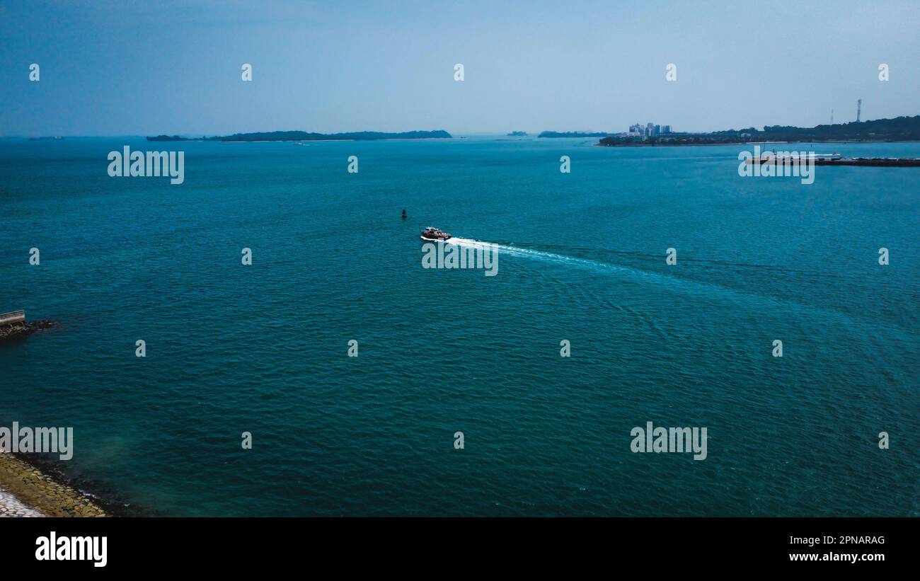 A boat from Maria port leaving towards its destination Stock Photo - Alamy