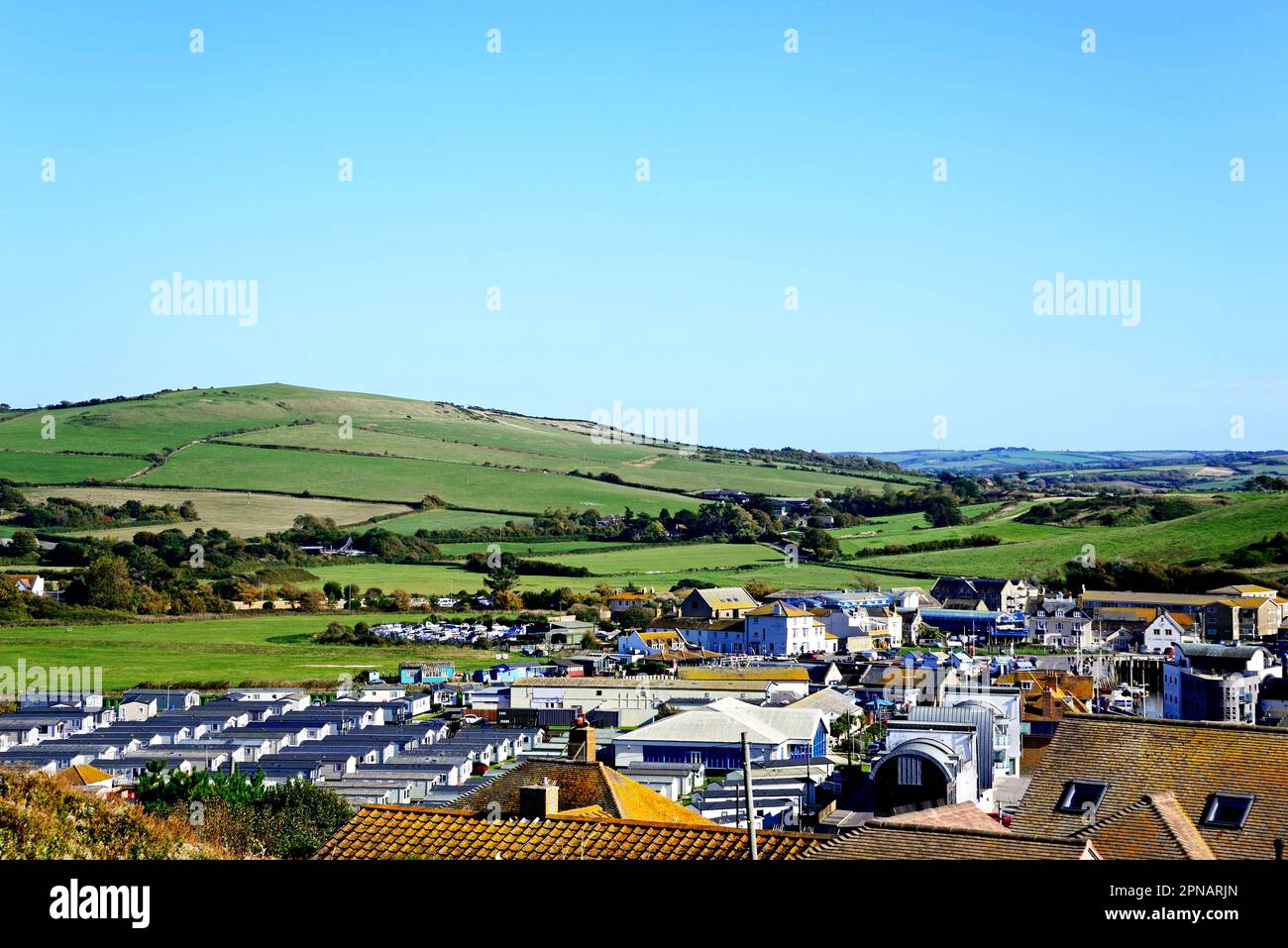 Elevated view across the town rooftops towards the countryside seen ...