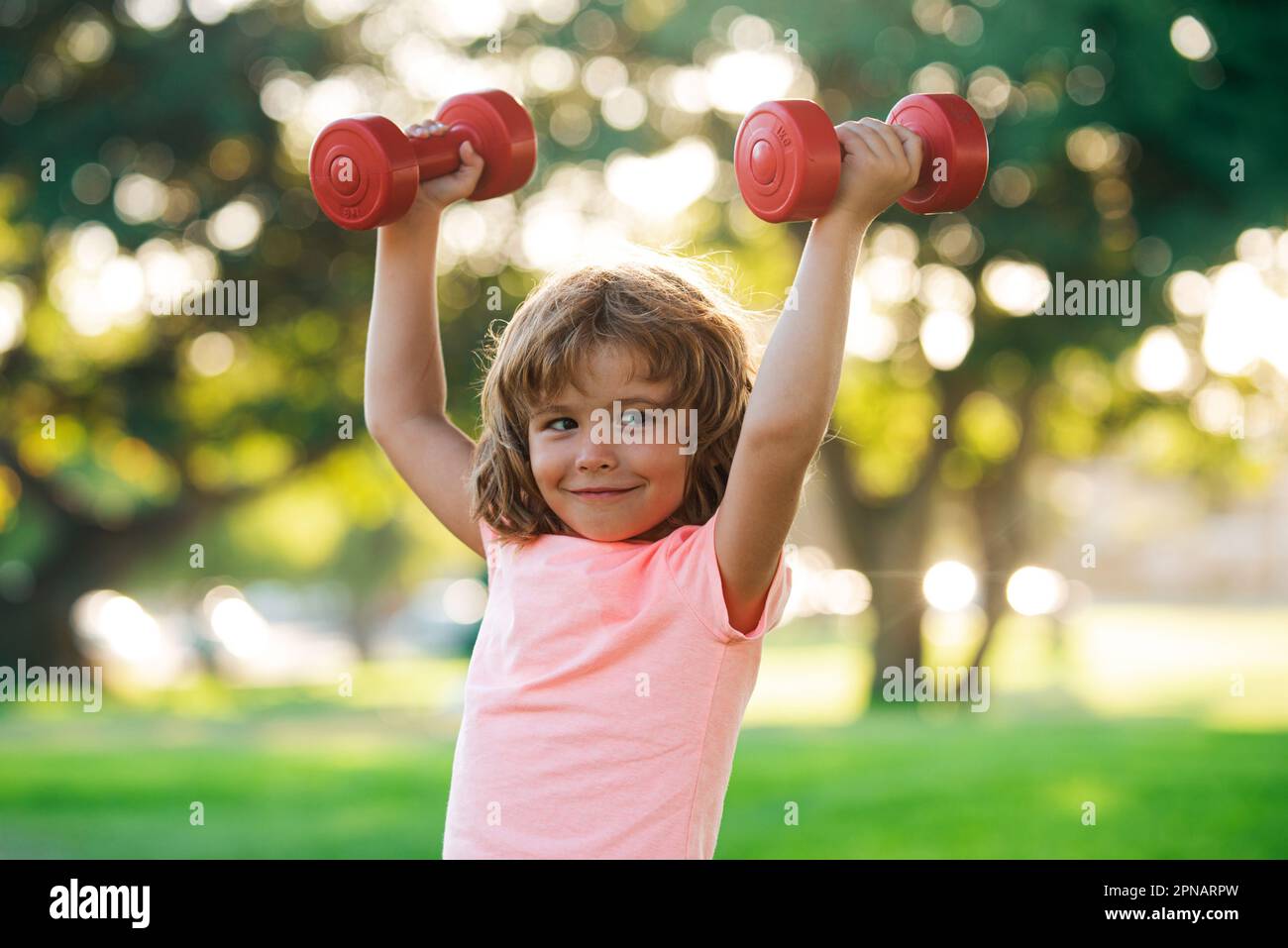 Kids sporty lifestyle. Boy workout in park. Kid sport. Child exercising ...