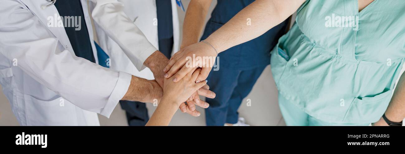 Group of professional medical team of doctors putting their hands ...