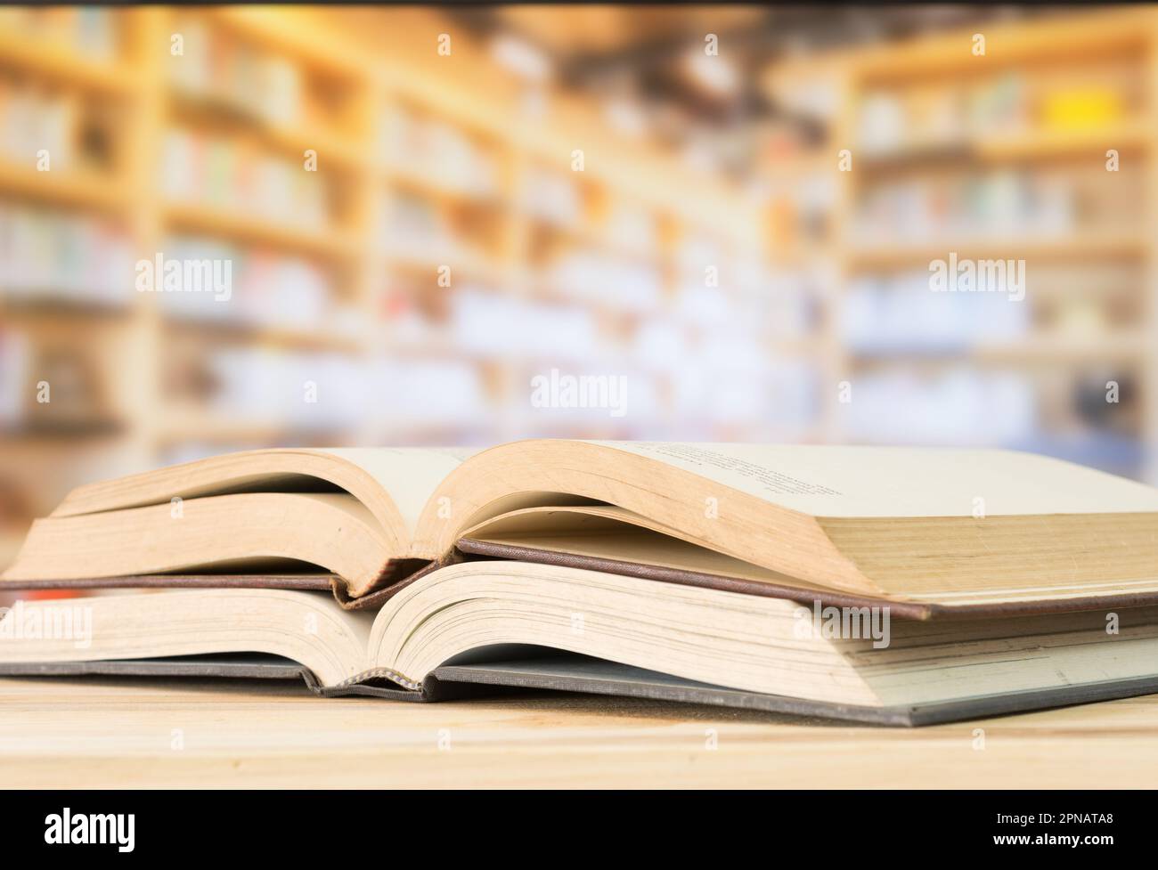 Open book on the desk in library. Education, books concept Stock Photo ...