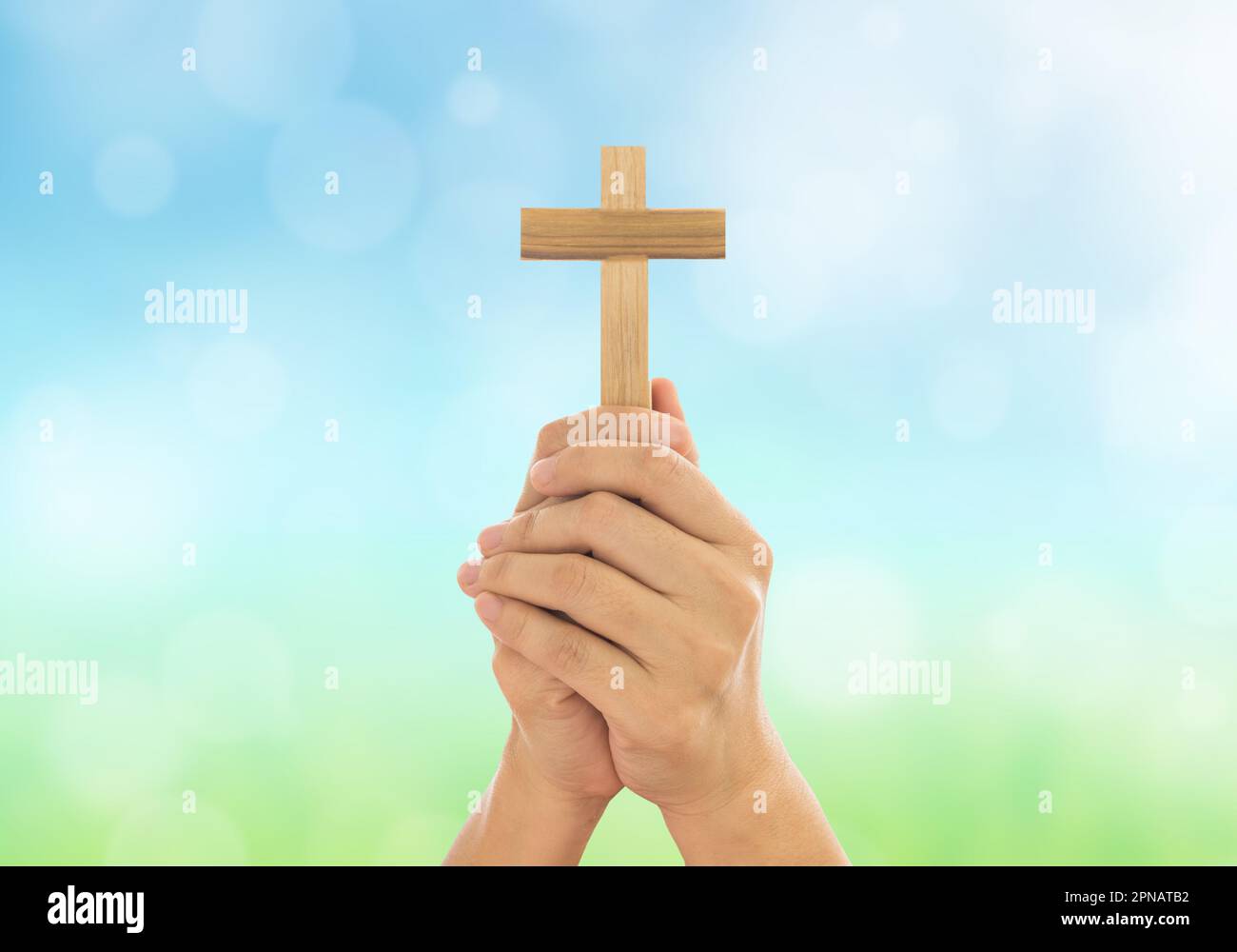 Human hands holding a cross holy and prayed for blessings from God ...