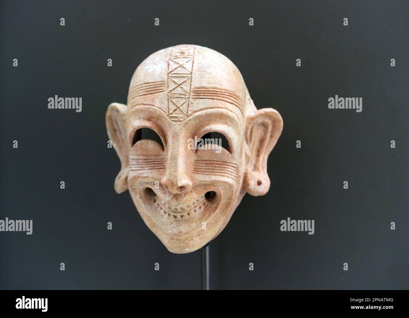 Ancient Sardonic Mask on Display at the Bardo Museum Stock Photo - Alamy