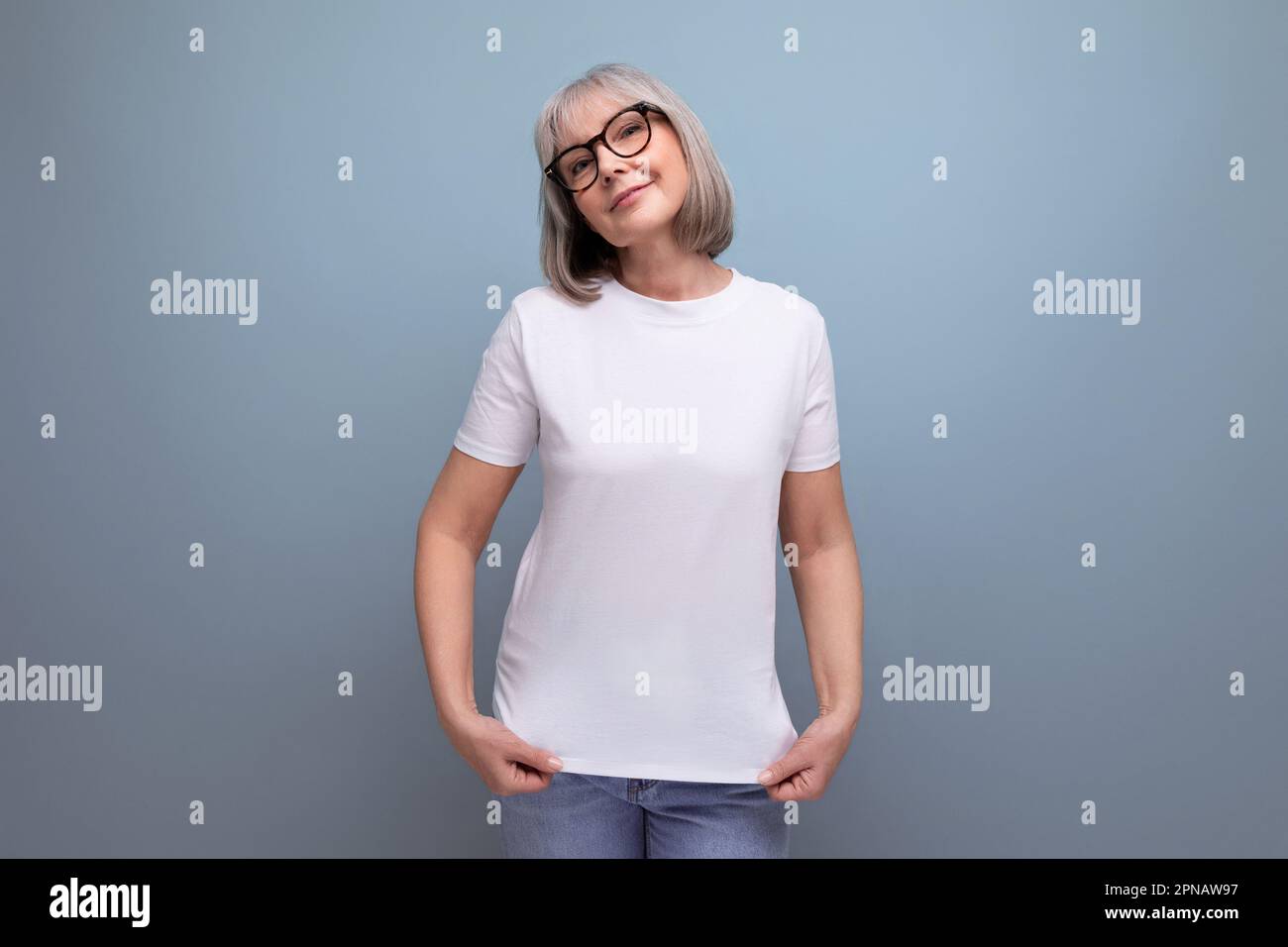 a mature woman of retirement age is in menopause in a white tank top on ...
