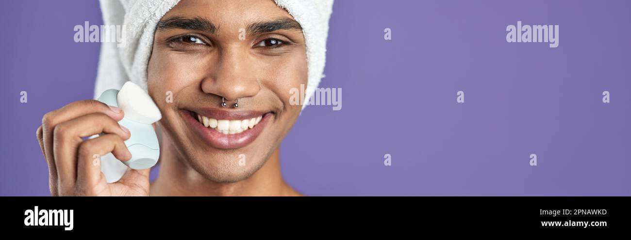 Afroamerican transgender young man looking camera and smile in towel ...