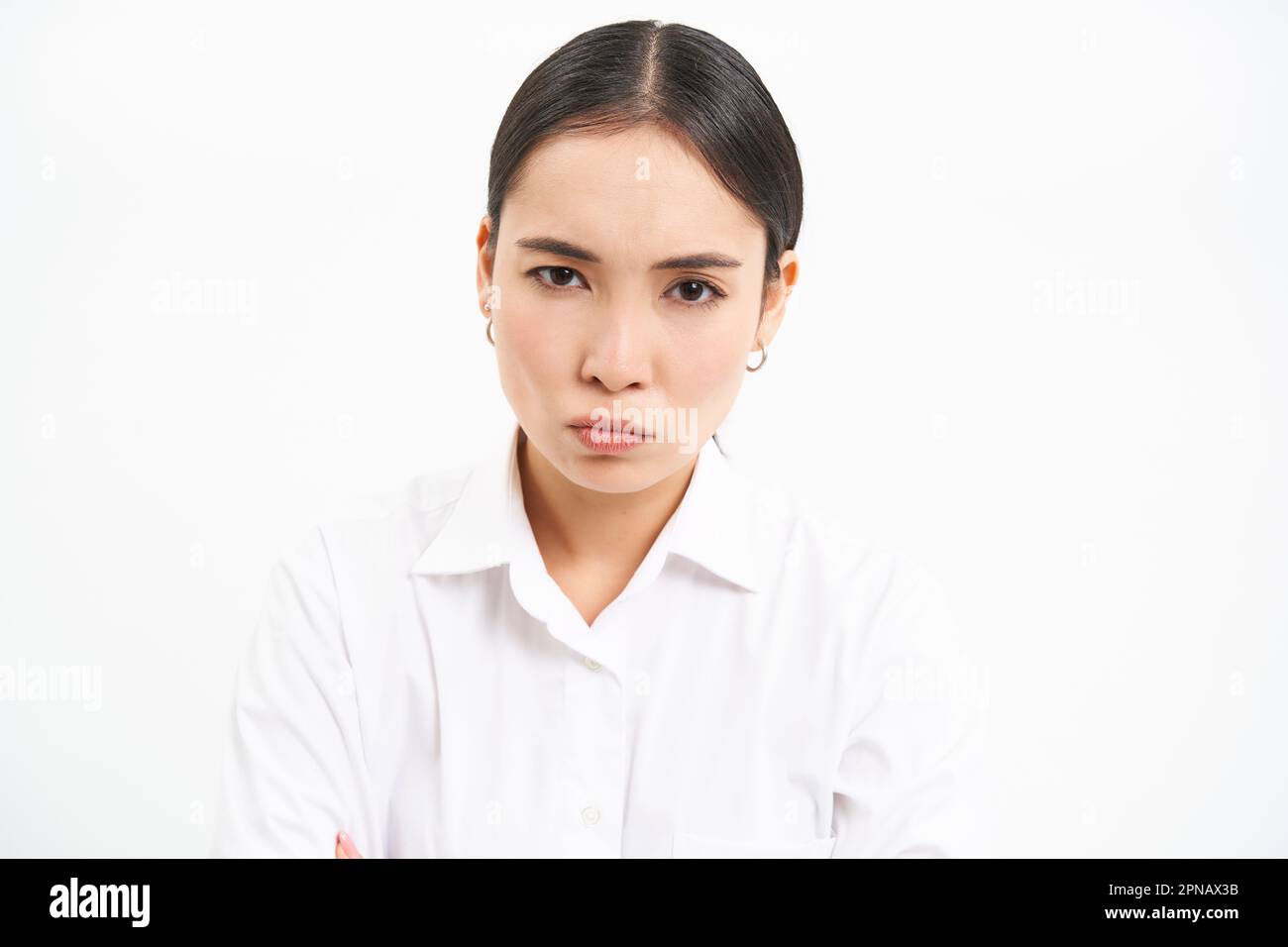 Corporate people. Serious and confident asian businesswoman, looking ...