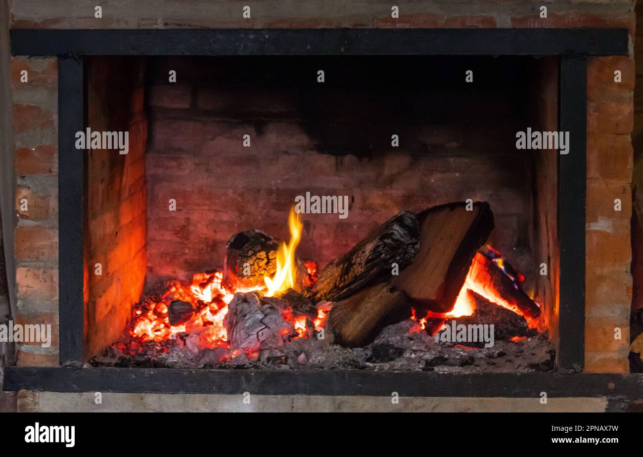 Cozy Fireplace with Bright Burning Flames and Textured Logs Stock Photo ...