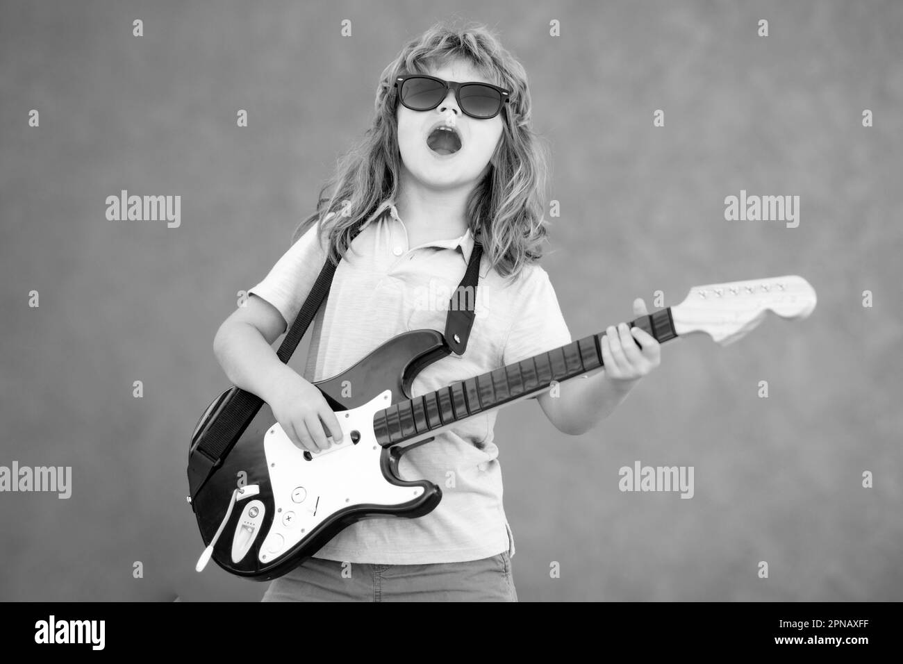 Child musician guitarist playing electric guitar, kid boy with guitar ...