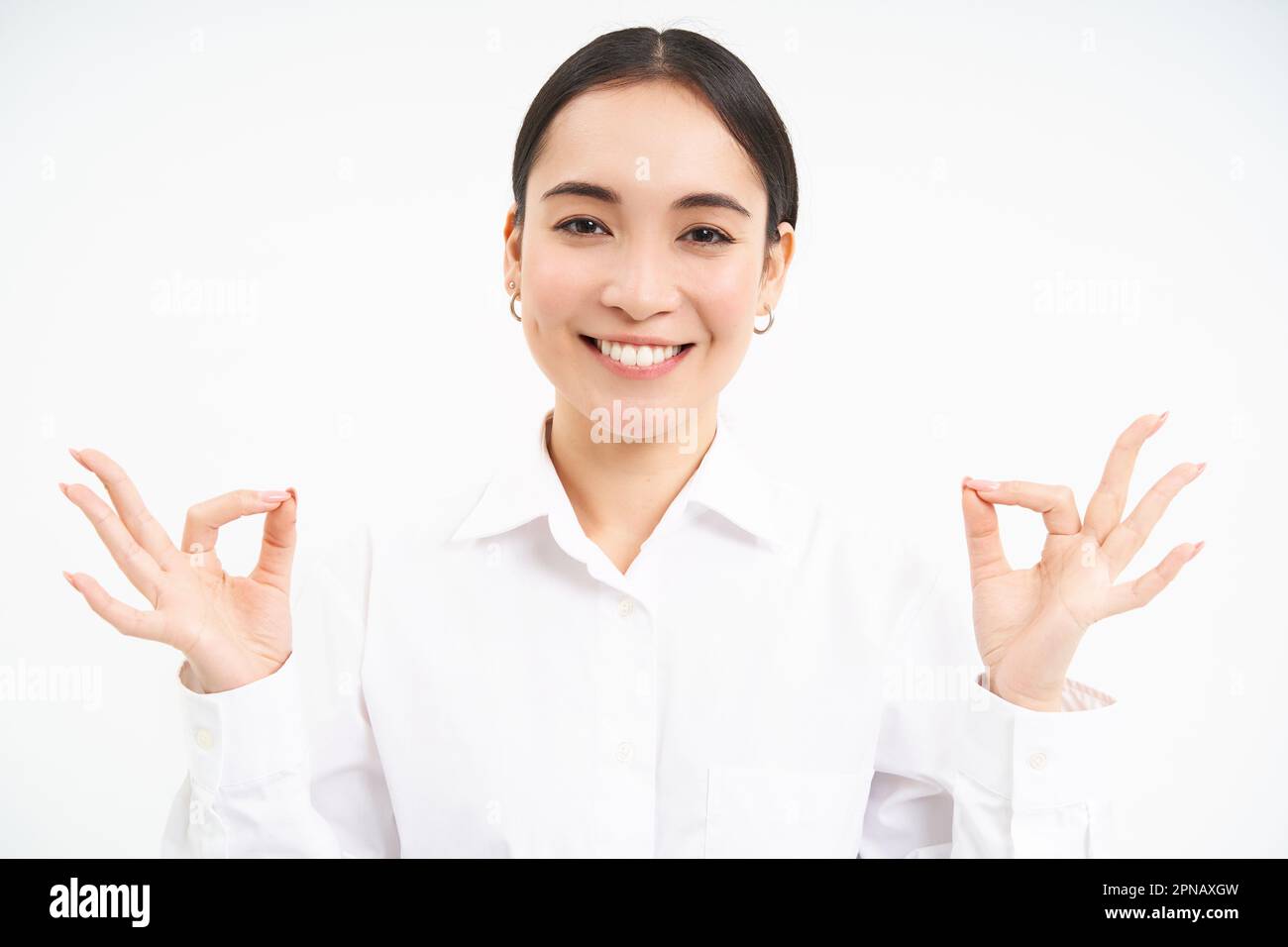 Asian business woman meditates, keeps patience, calms down, breathes in ...