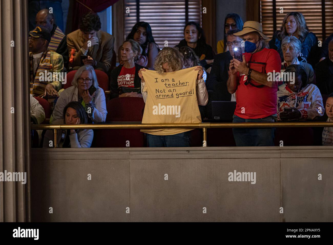 NASHVILLE, TENNESSEE - APRIL 17: A gun safety advocate holds a sign in ...