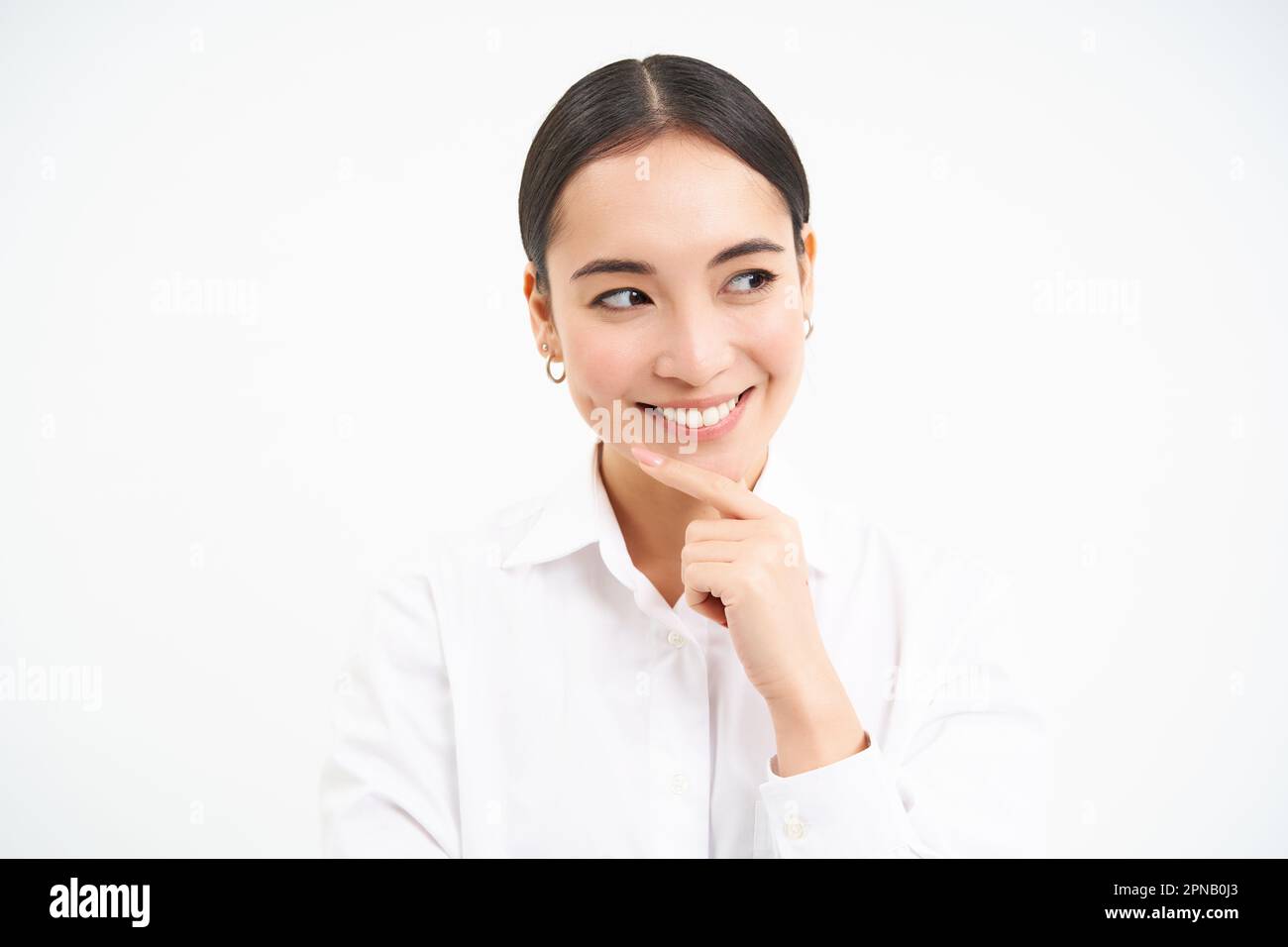 Successful asian woman, business professional, smiling with intrigued ...