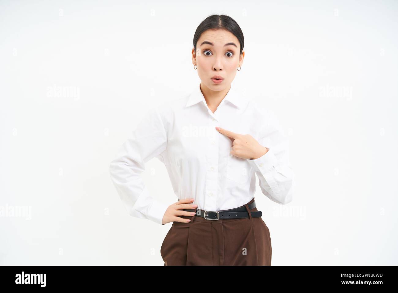 Portrait of asian woman looks surprised, points at herself with ...