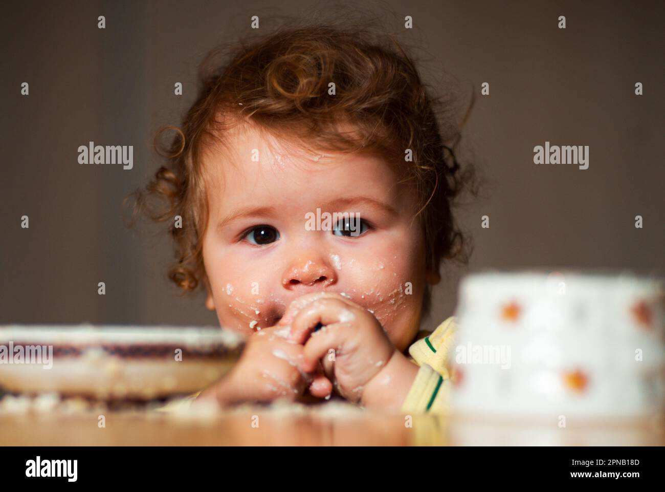 Little baby are eating. Little child eating fruit puree Stock Photo - Alamy