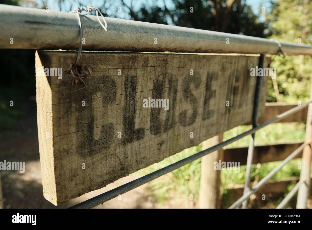 Rustic Wooden Sign Tied to a Farm Gate Stock Photo - Alamy