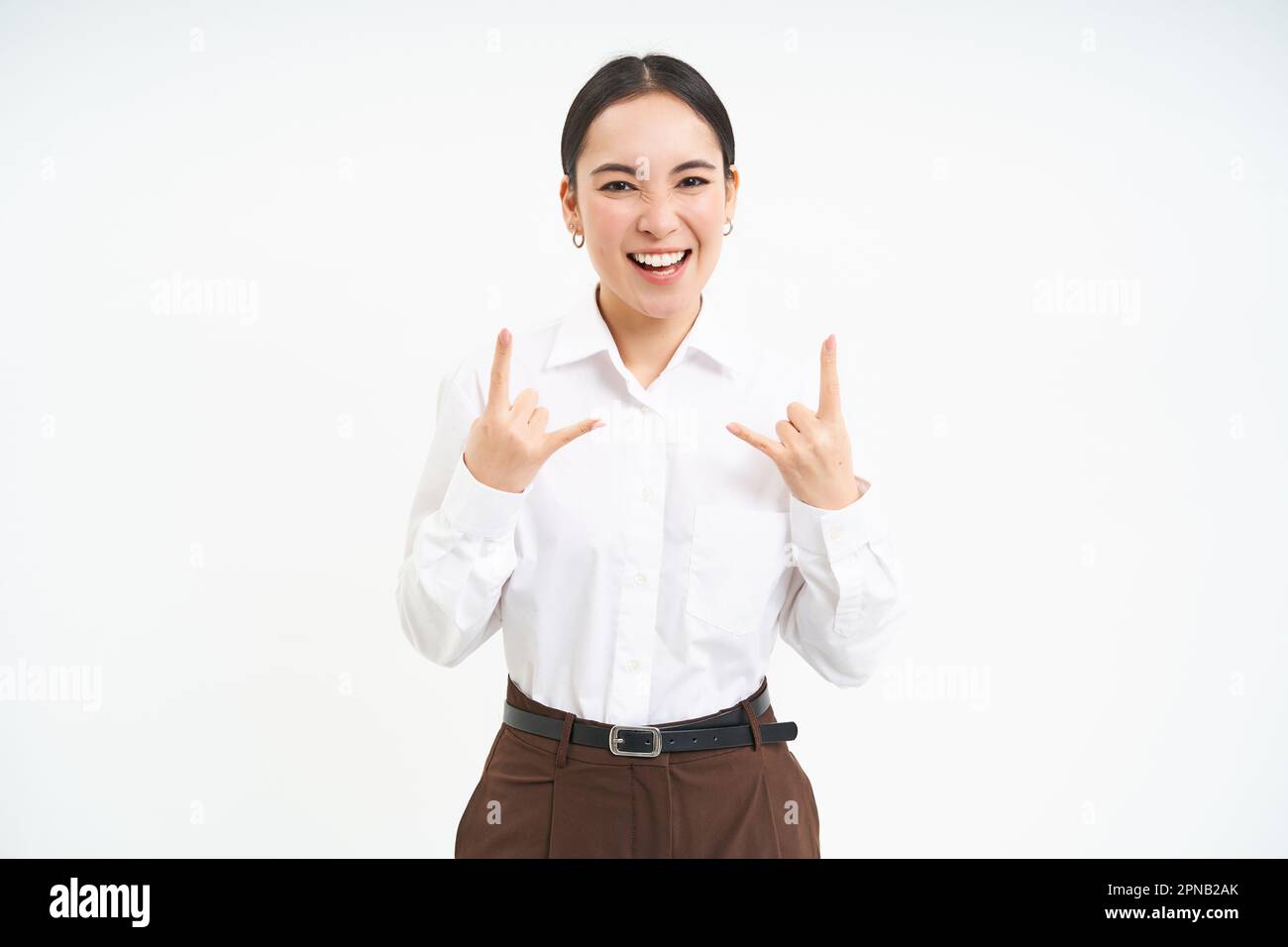 Excited smiling businesswoman, asian female employee, has fun, shows ...