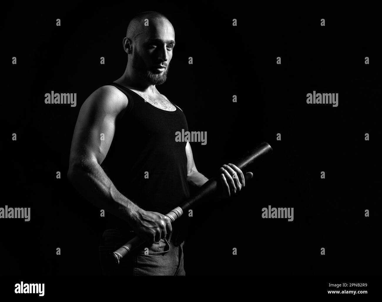 Portrait of man with serious face. Brutal man with baseball bat for ...