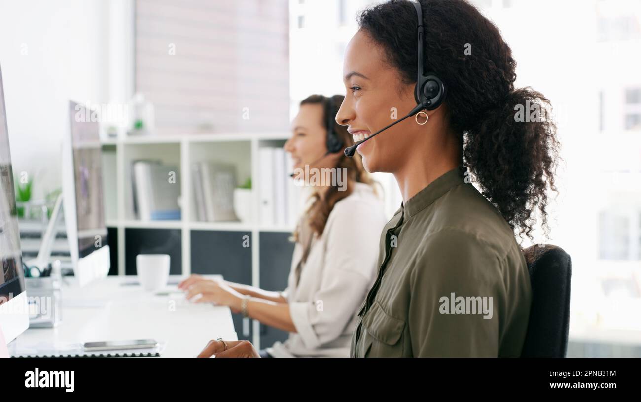 Let me update your details for you. a young woman using a computer and ...