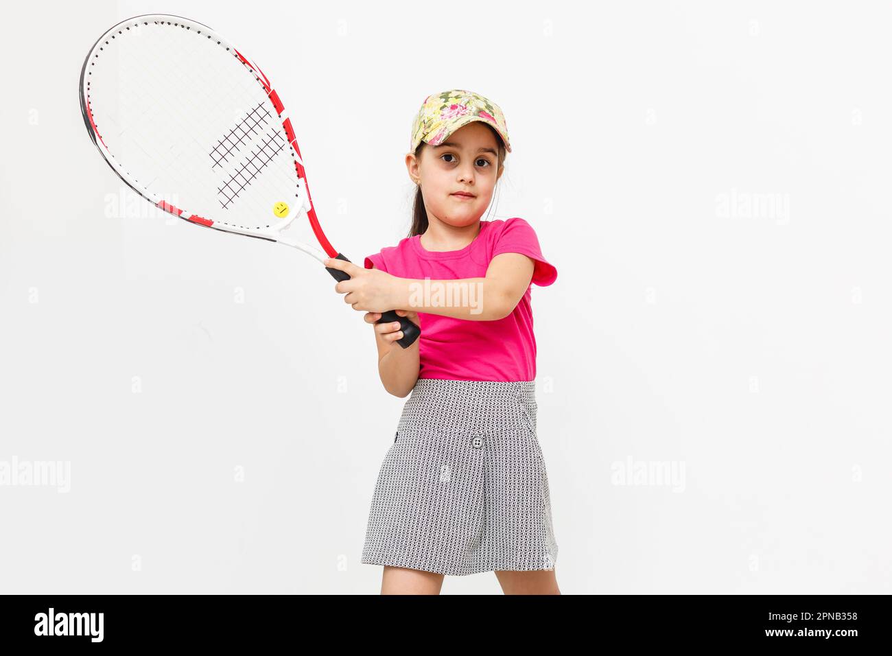 little girl with a tennis racket Stock Photo - Alamy