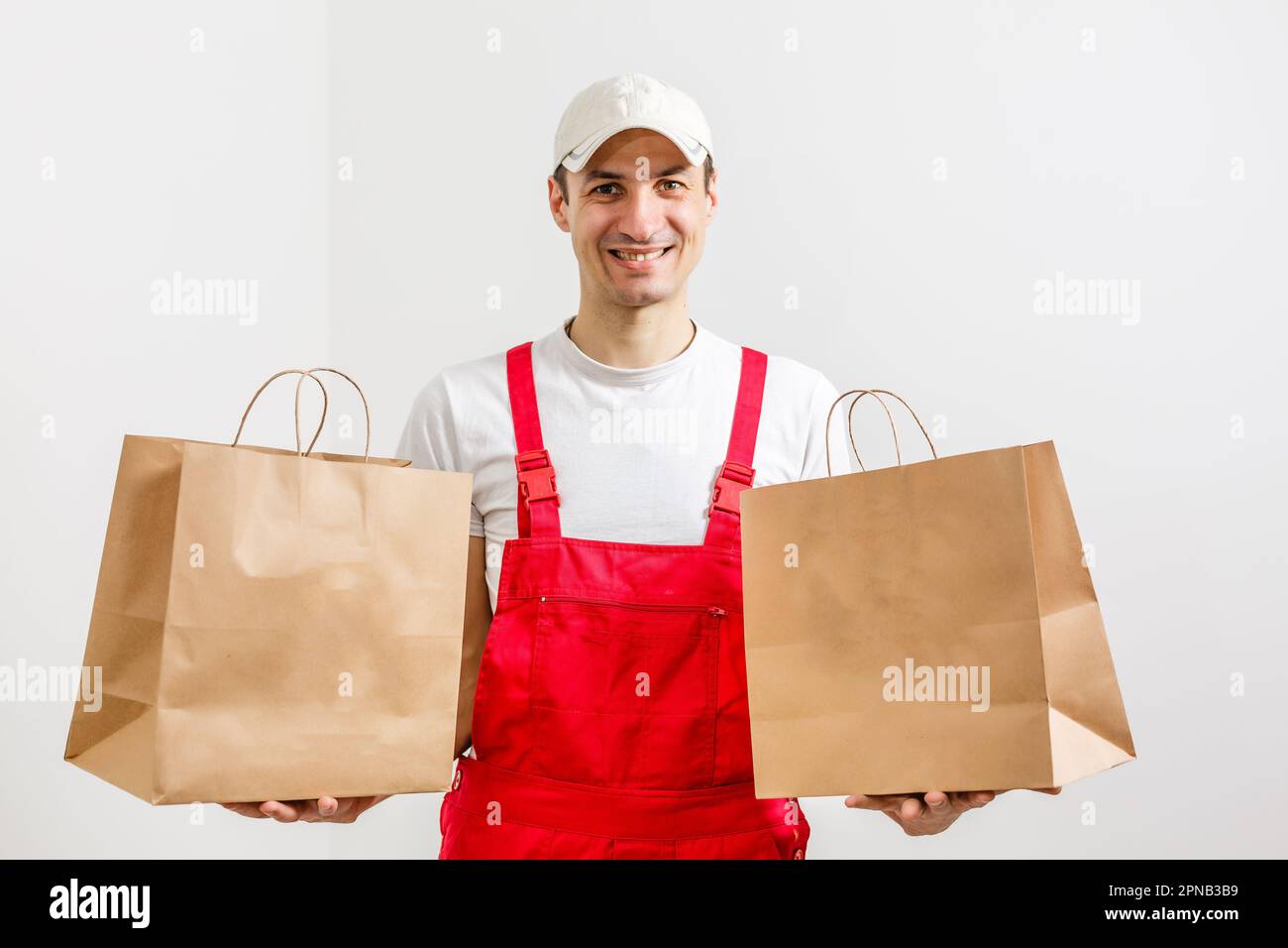 paper containers for takeaway food. Delivery man is carrying Stock ...