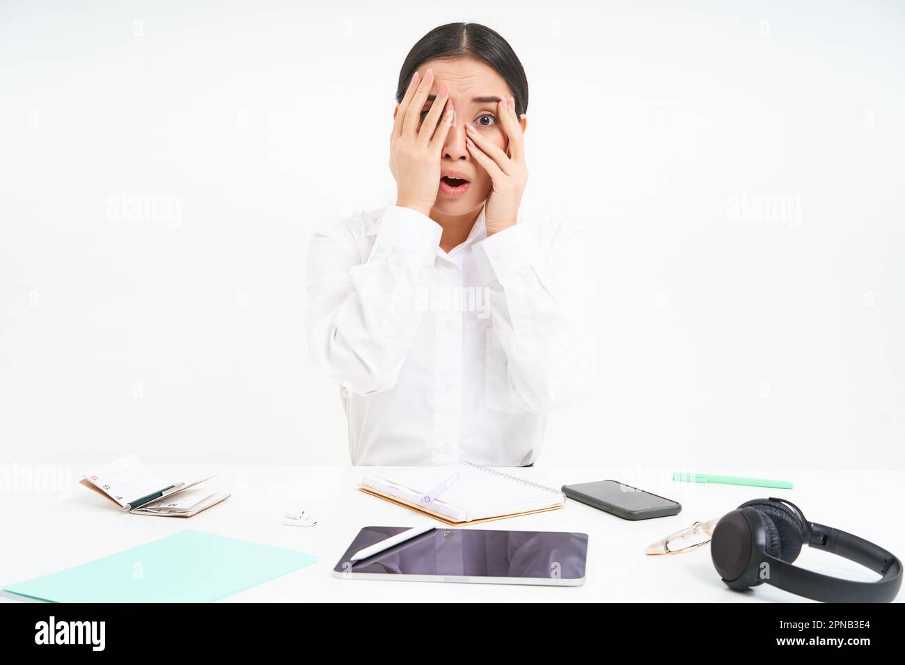 Image of asian office lady shuts her eyes embarrassed, sees something ...