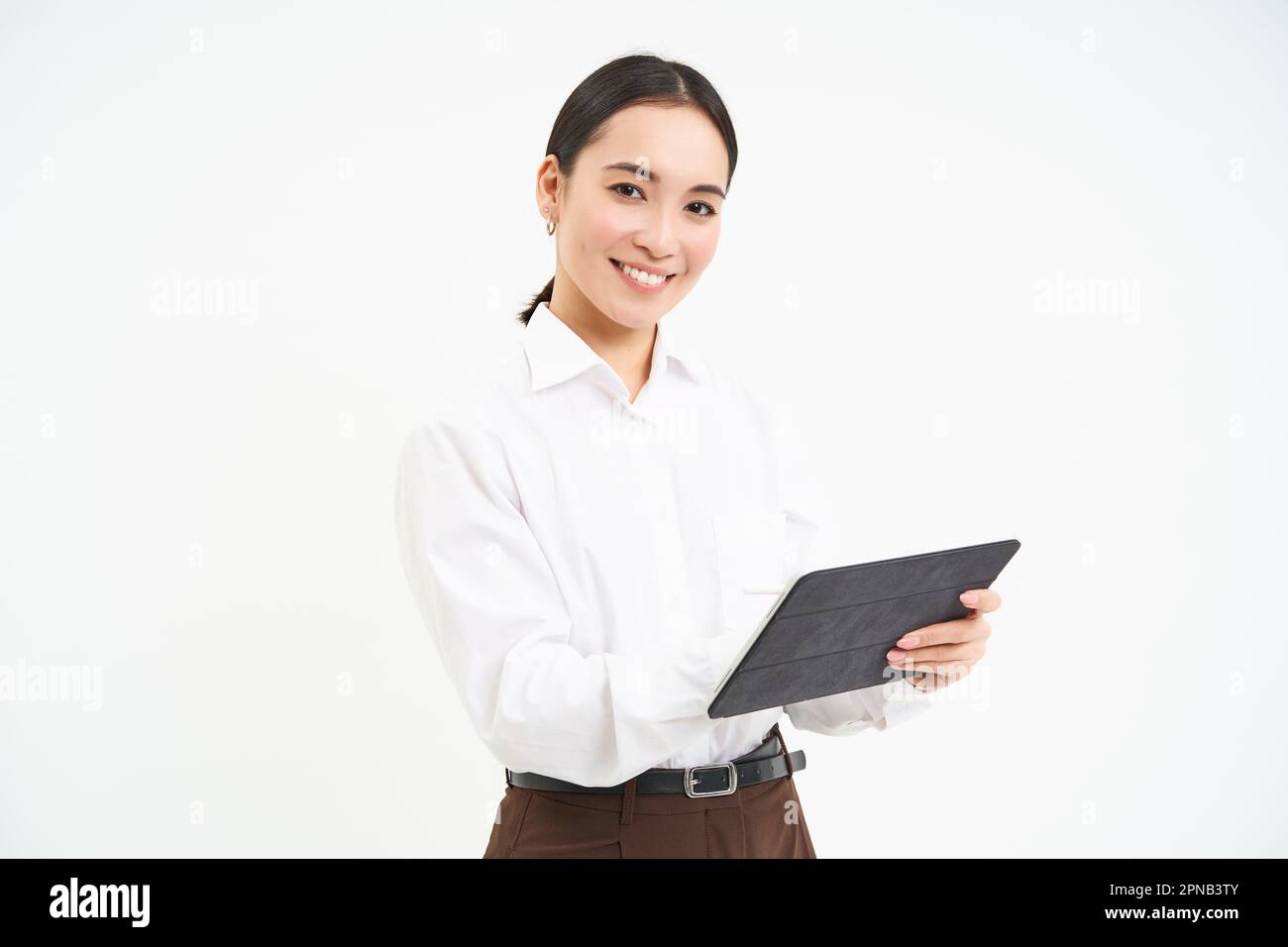 Asian woman professional, standing with digital tablet, working on ...