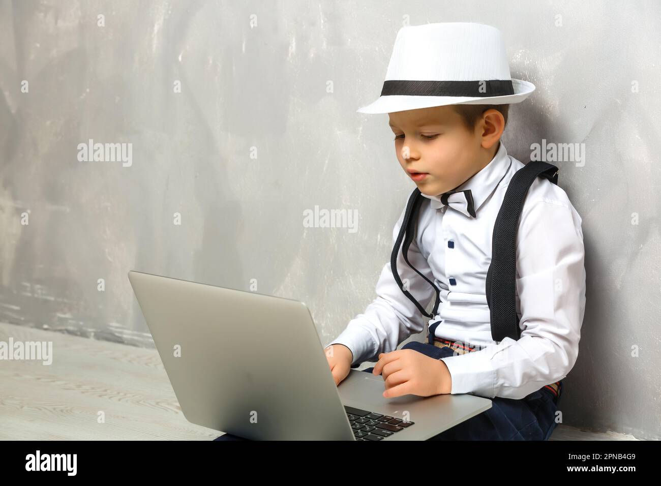 Portrait of Genius. Young boy working on the computer sitting On the ...