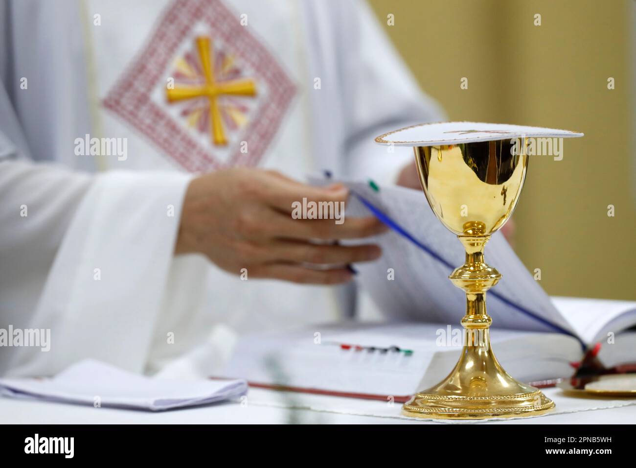 Sunday mass. Priest at eucharist celebration. Roman catholic church. Ho ...