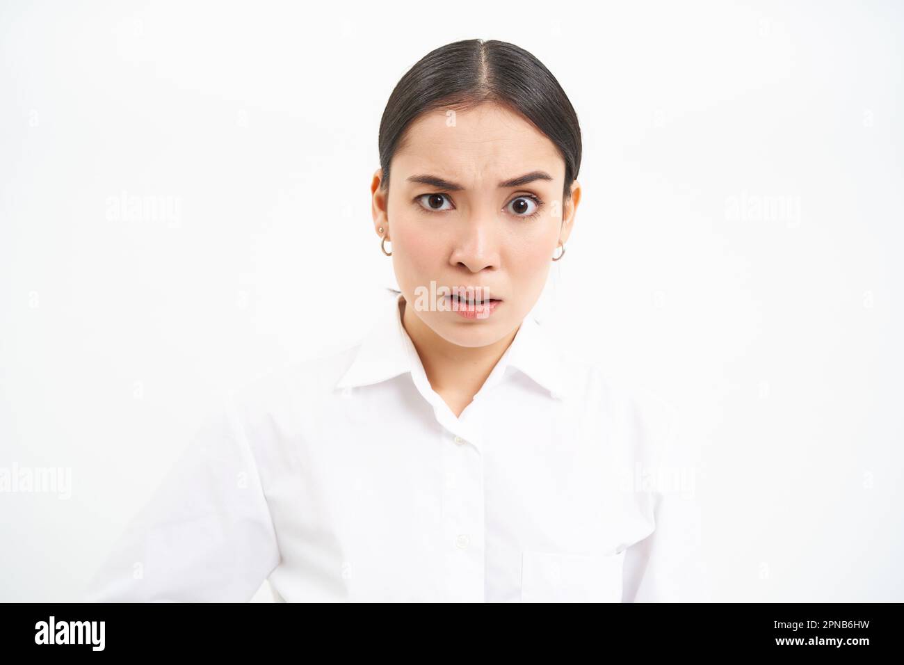 Portrait of asian businesswoman, office lady with shocked face, looks ...