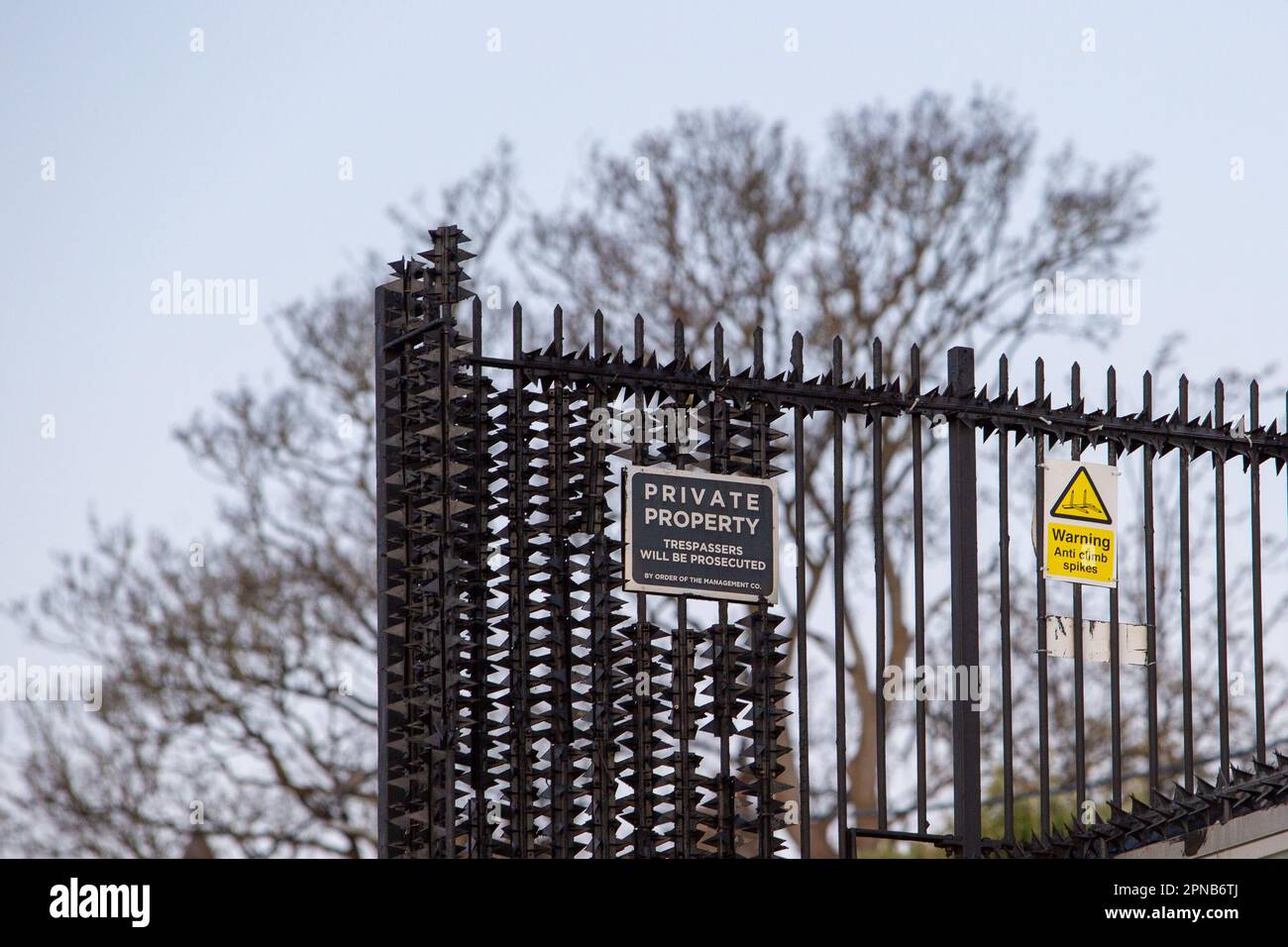 Perimeter security fencing with anti climb spikes and warning signs ...