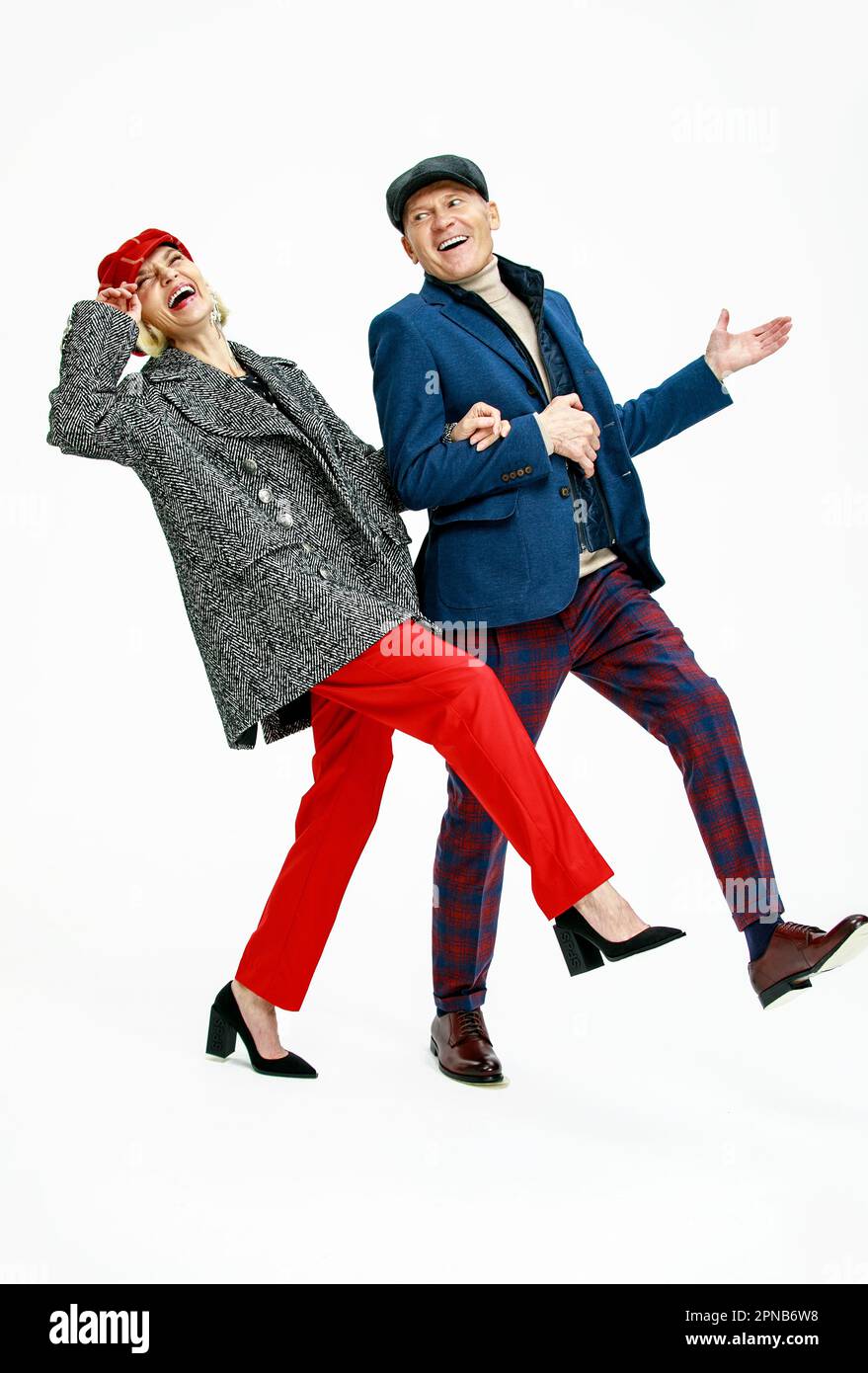 Stylishly dressed couple of pensioners pose in the studio Stock Photo ...