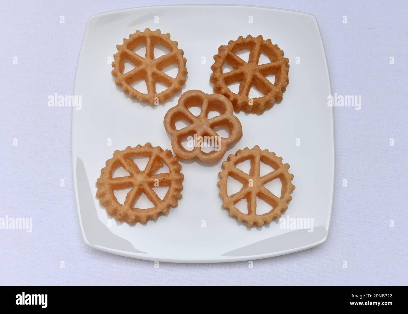 Overhead view of few crispy Sri Lankan food known as the Kokis on top ...