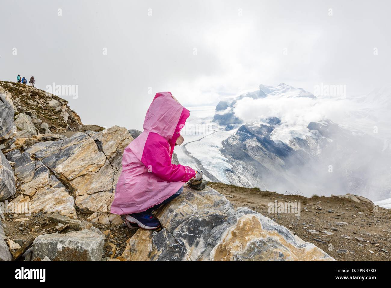Children hiking in Alps mountains. Kids look at mountain in Austria ...