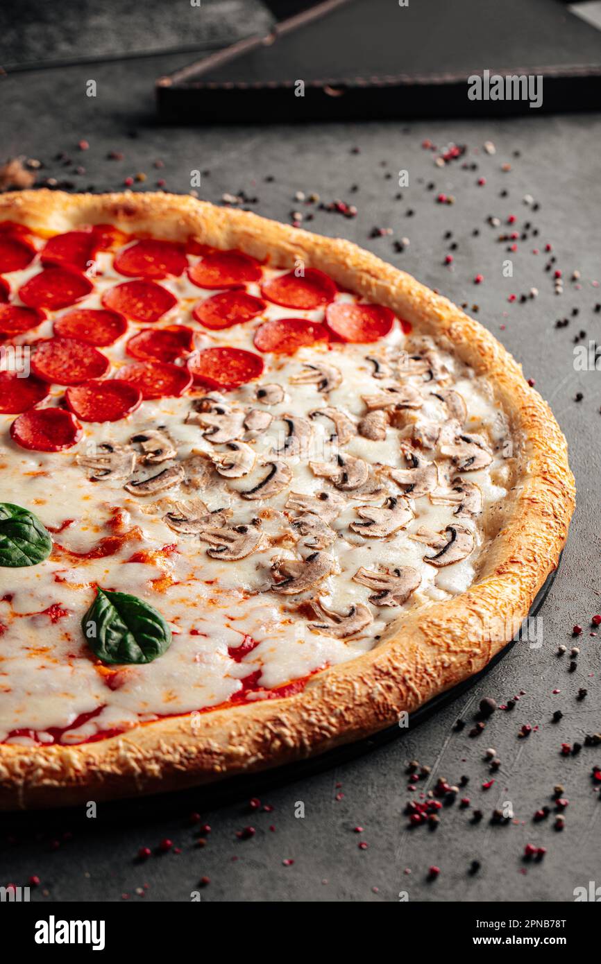 Assorted four seasons pizza variety of toppings Stock Photo - Alamy