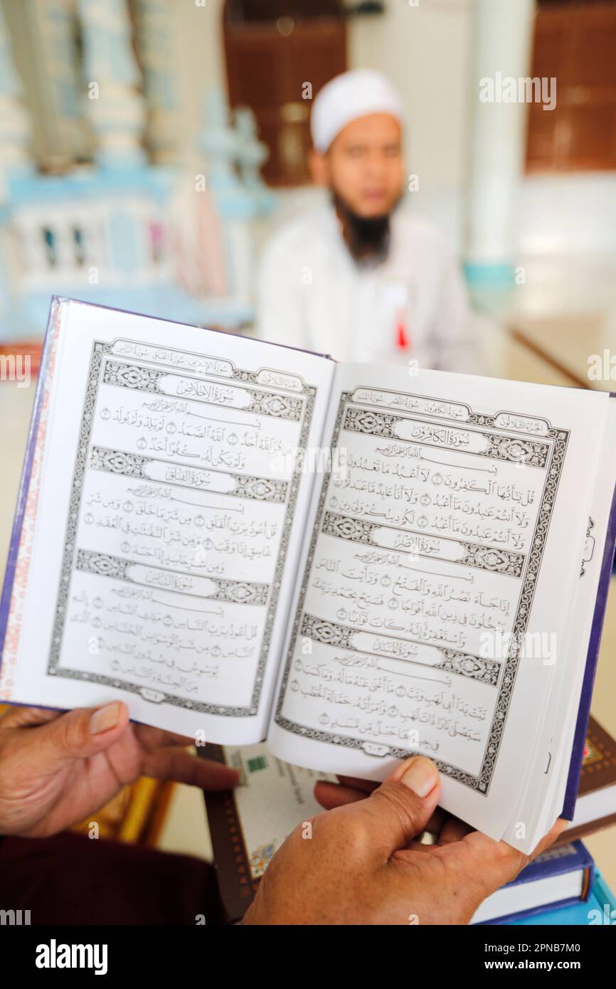 Masjid Nia'mah mosque. Muslim men reading the Holy Quran. Chau Doc ...