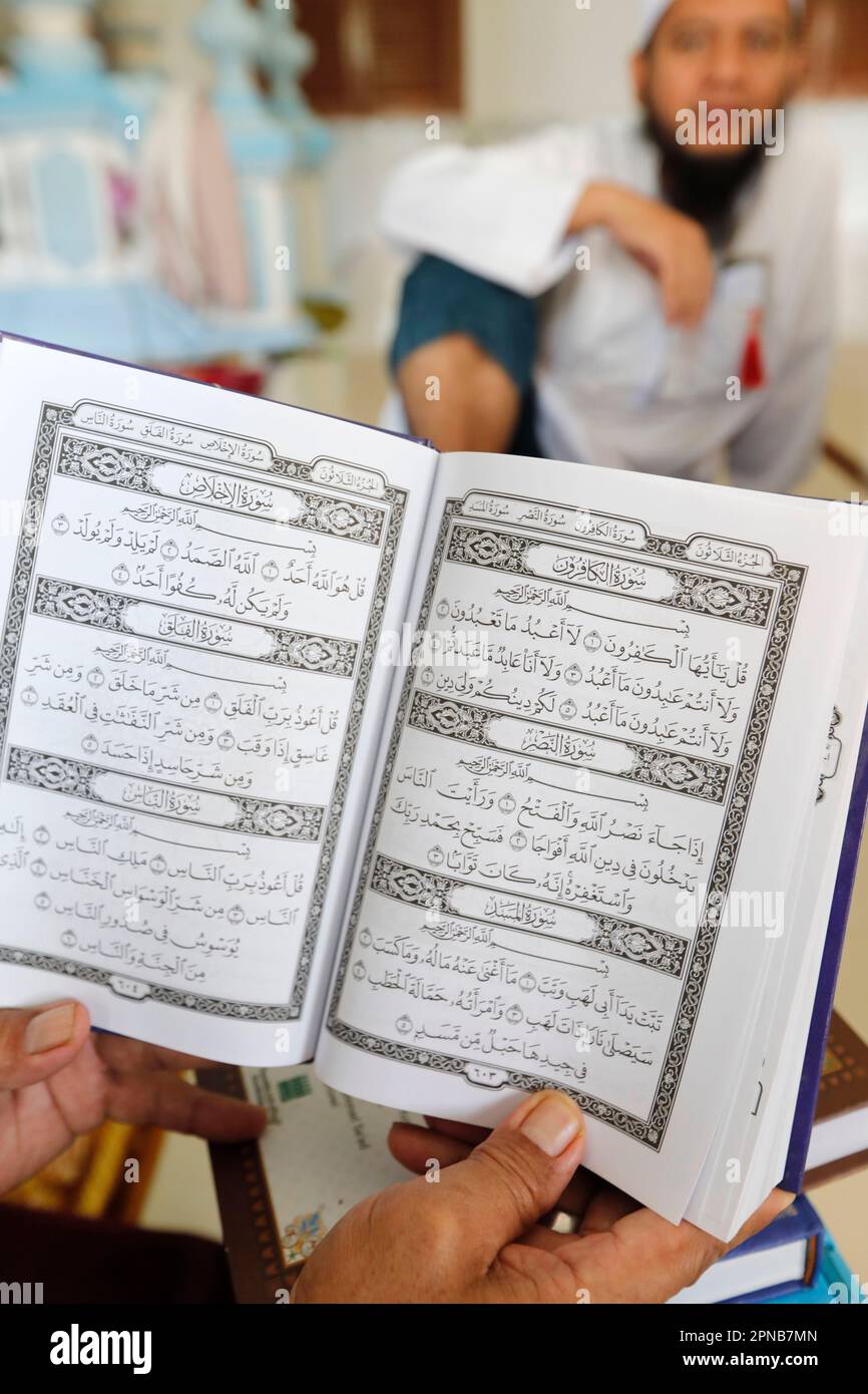 Masjid Nia'mah mosque. Muslim men reading the Holy Quran. Chau Doc ...