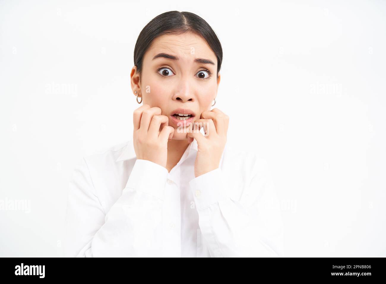 Portrait of asian businesswoman looks scared, stares terrified and ...