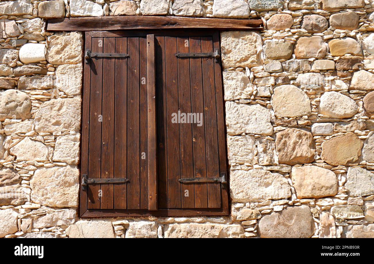 Shuttered window in stone wall, Episkopi village, near Pafos, Republic ...