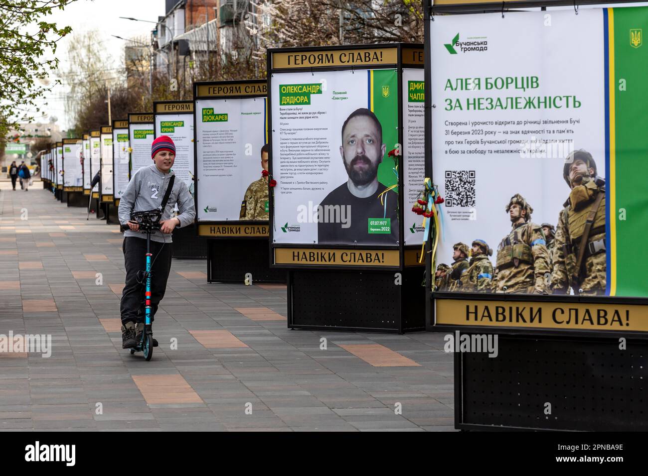 Bucha, Ukraine. 17th Apr, 2023. A boy rides on an alee dedicated to ...