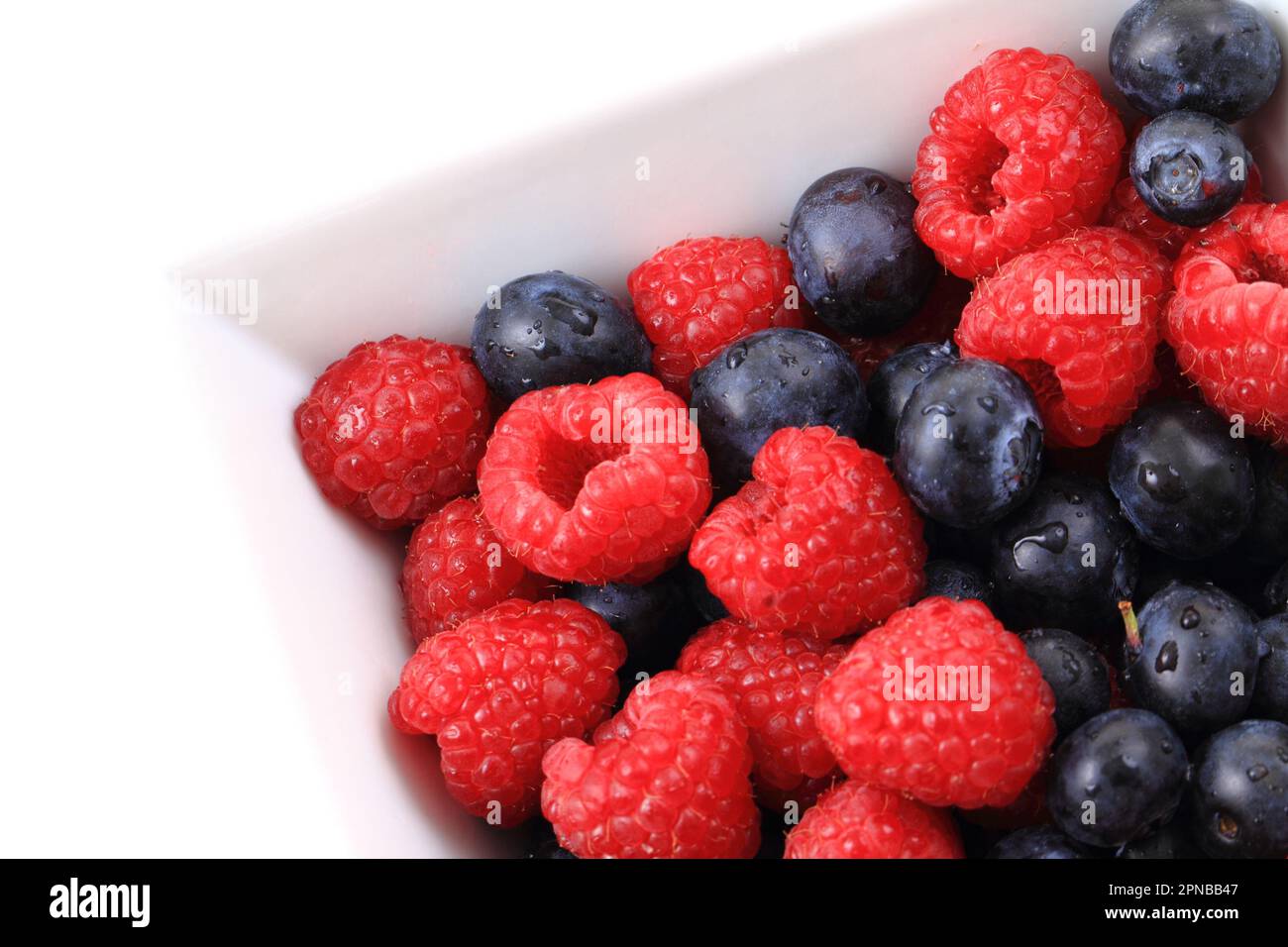 raspberries and blueberries as nice fruit background Stock Photo - Alamy