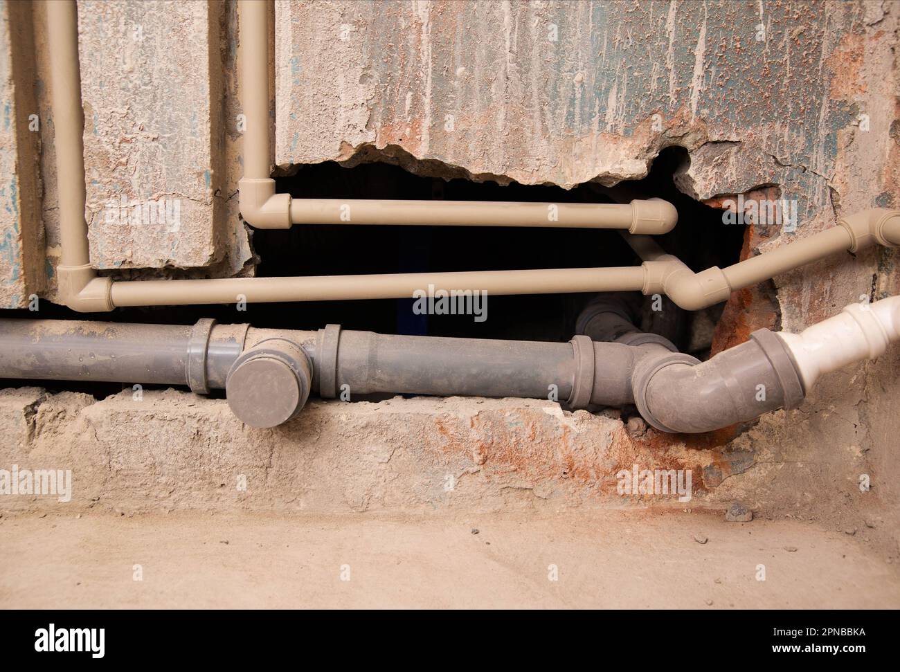 Transfer of water pipes and sewerage drain in the wall. Bathroom ...