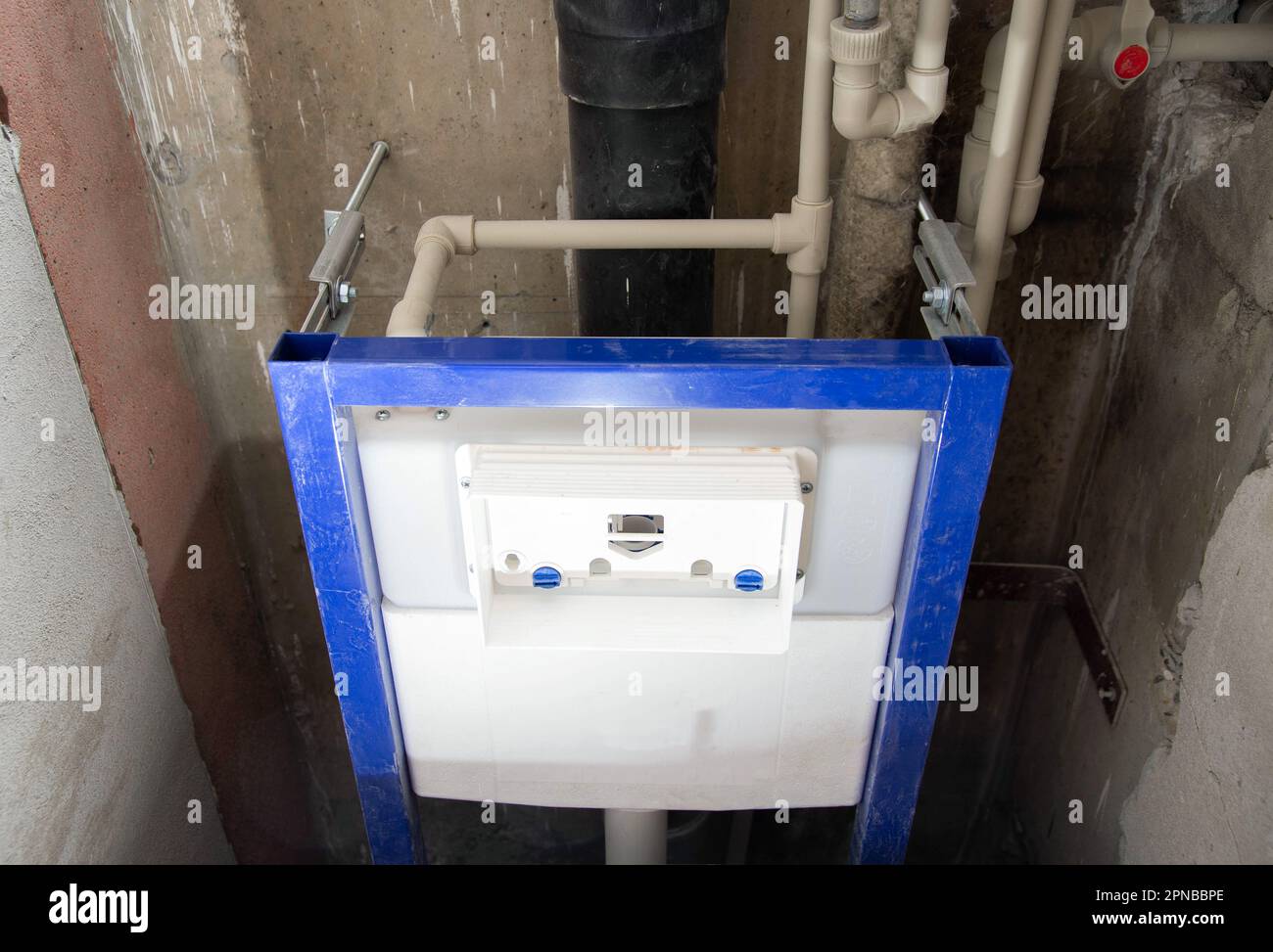 Installation of a new wall-hung toilet with a water drain installation ...