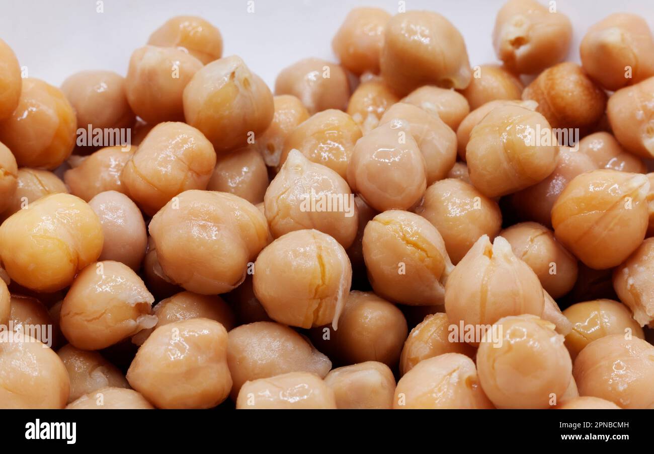 chickpeas from tin on white background Stock Photo - Alamy
