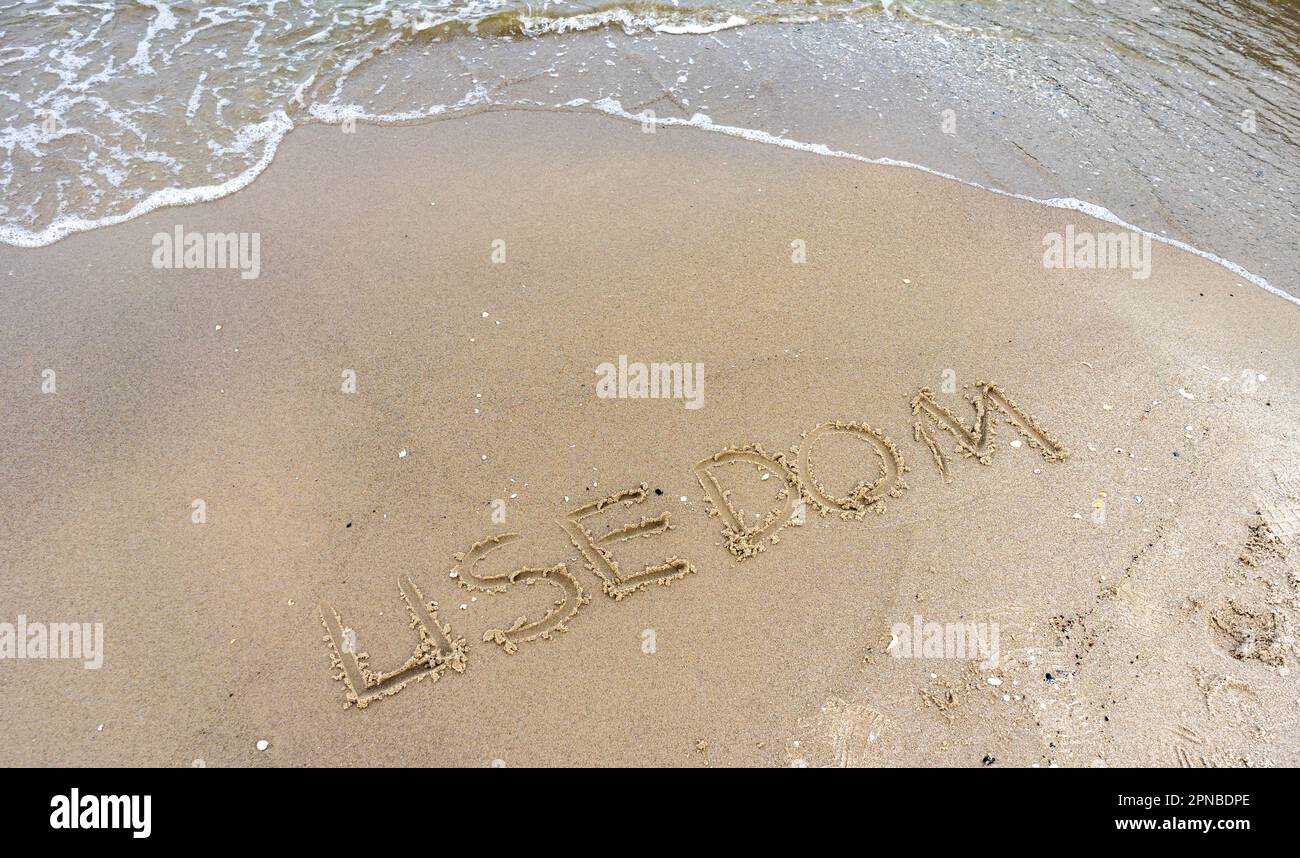Sandy beach on the island of Usedom, with the lettering 'Usedom' Stock ...