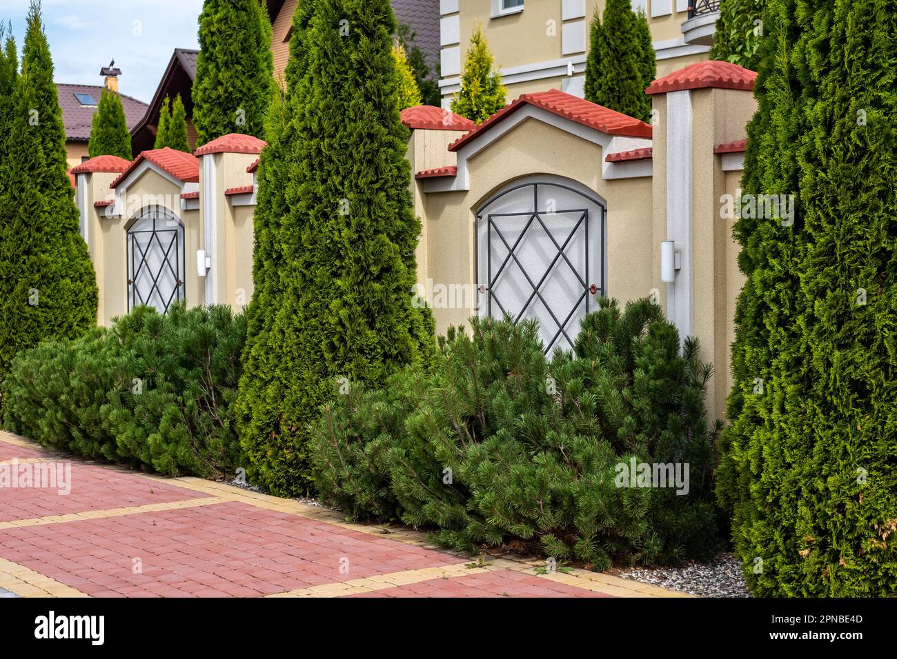 Beautiful decorative cement fence with inserts and tiles Stock Photo ...