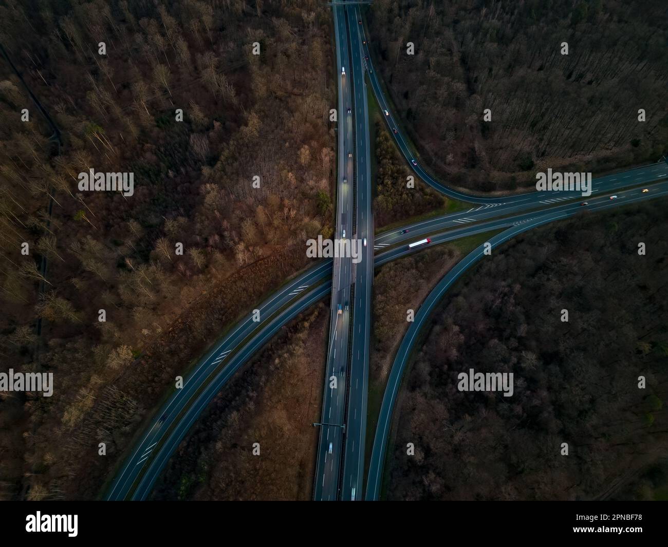 An aerial view of highways surrounded by greenery in the countryside ...