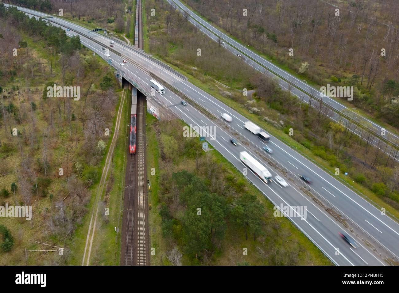 An aerial view of highways surrounded by greenery in the countryside ...
