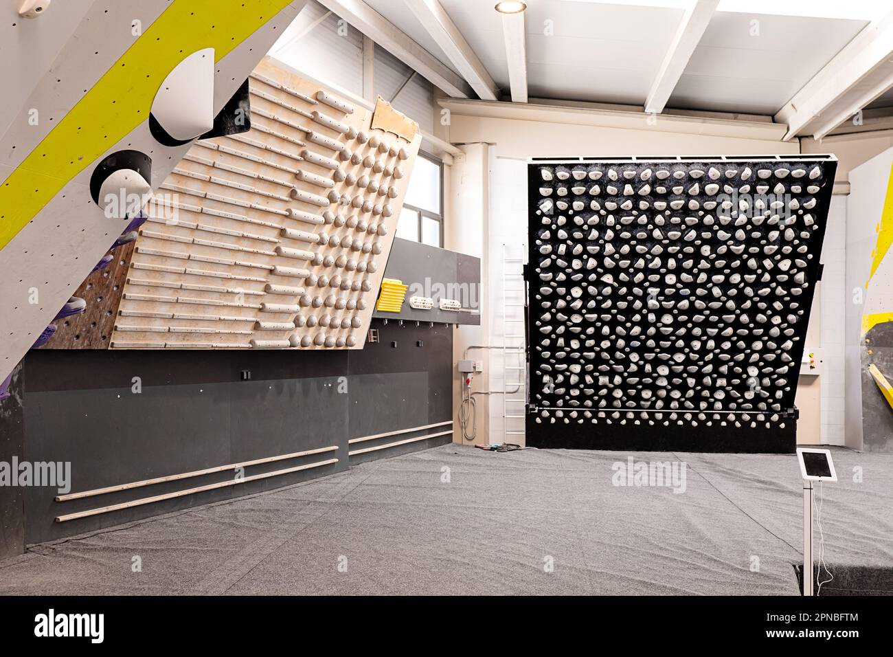 Kilter boards in square shape placed in gym supporting adjustable or ...